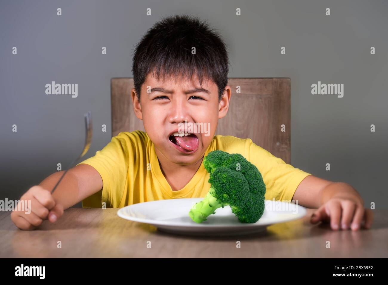 8 years old disgusted and displeased child refusing to eat healthy ...