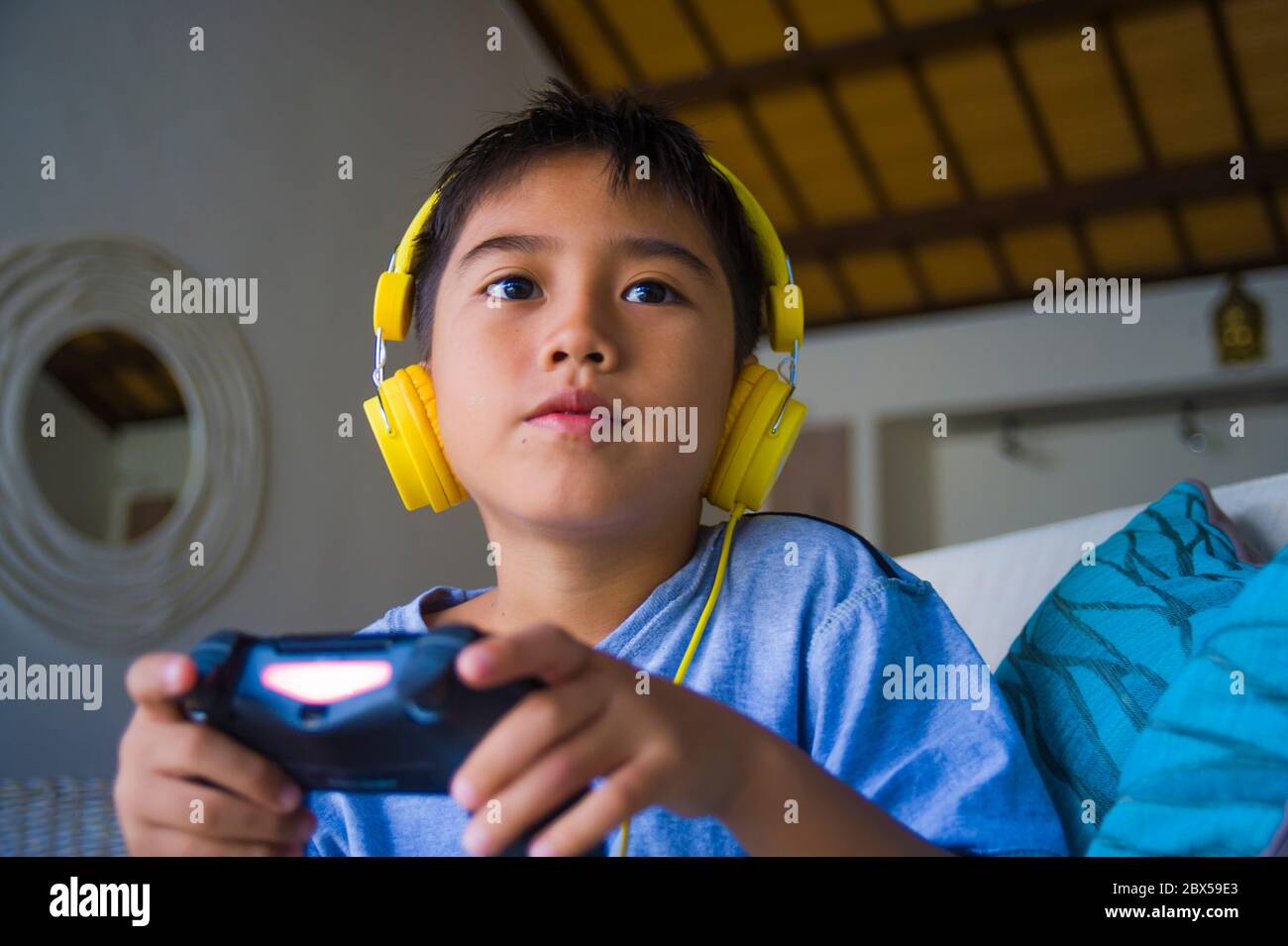 lifestyle portrait of south Asian little kid excited and happy playing ...