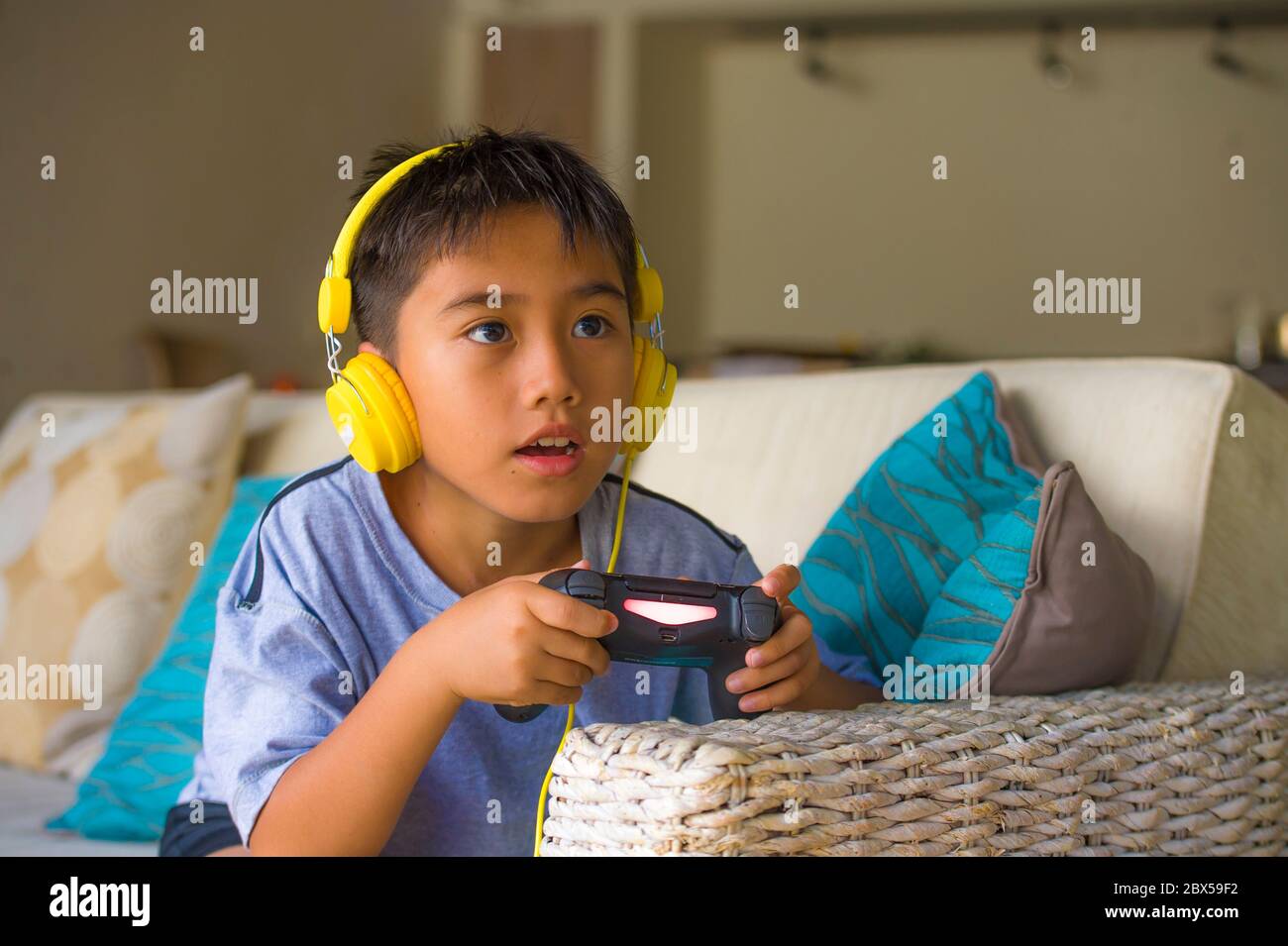 lifestyle portrait of south Asian little kid excited and happy playing ...