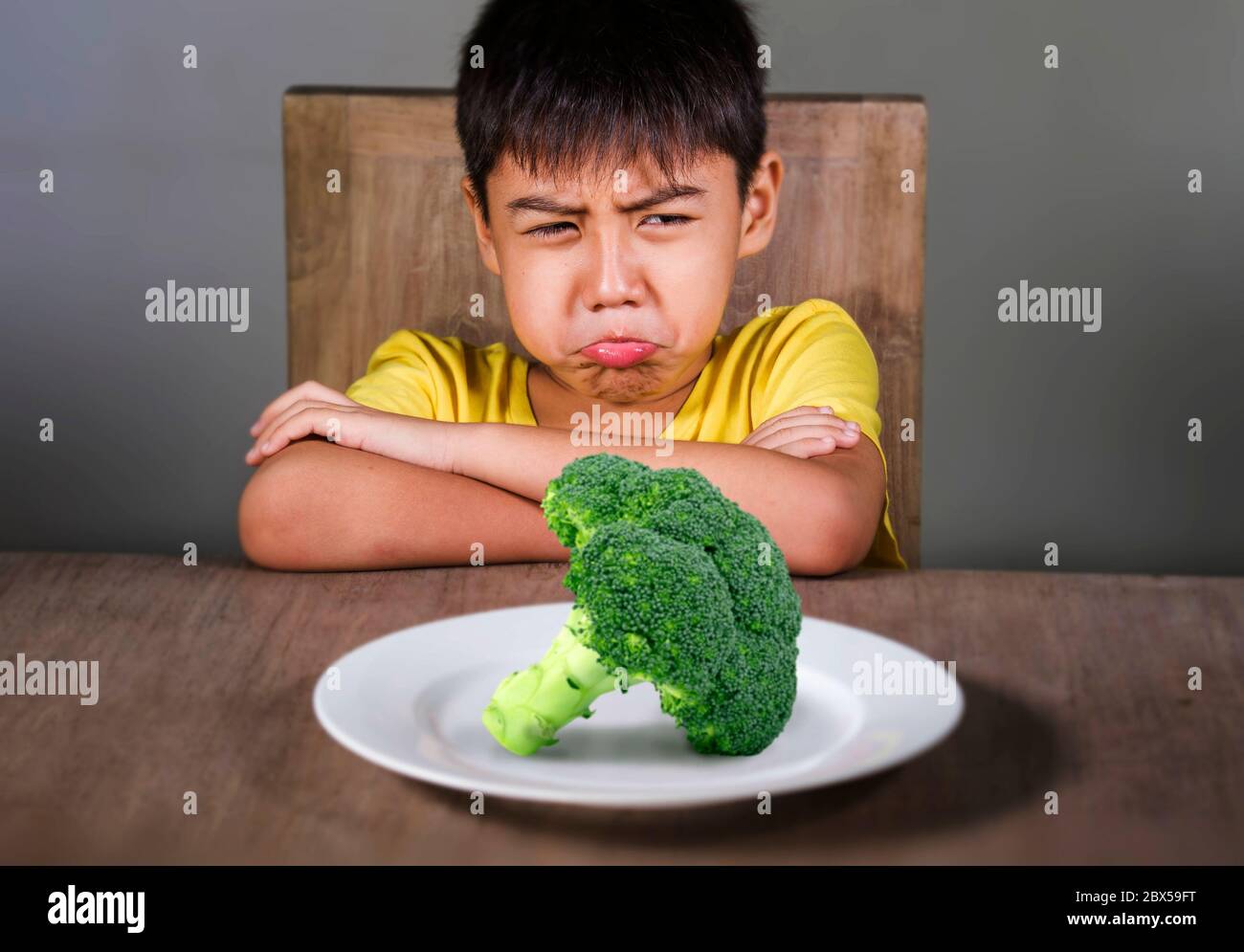 8 years old disgusted and displeased child refusing to eat healthy ...