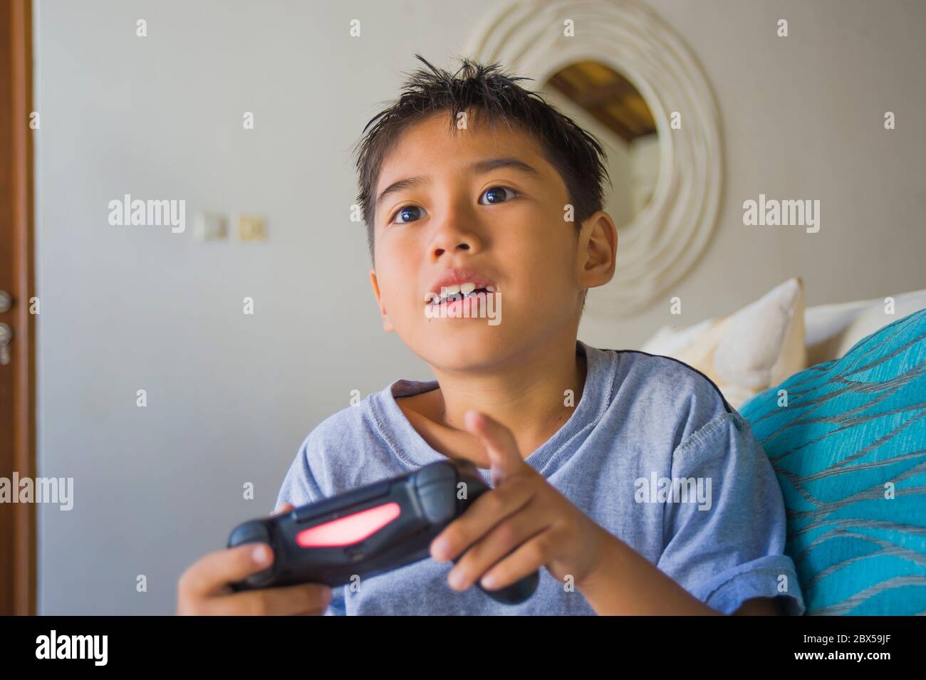 lifestyle portrait of young south Asian little kid excited and happy ...