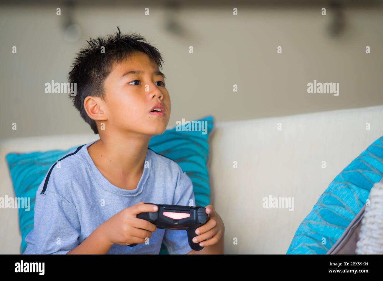 lifestyle portrait of Latin young kid 8 years old excited and happy ...
