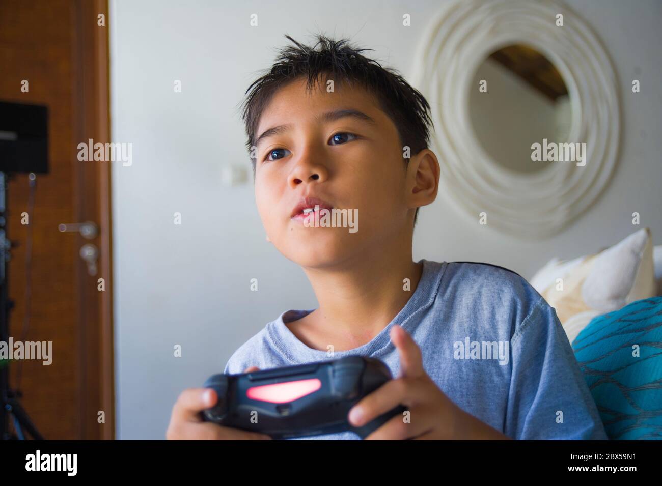 lifestyle portrait of Latin young kid 8 years old excited and happy ...
