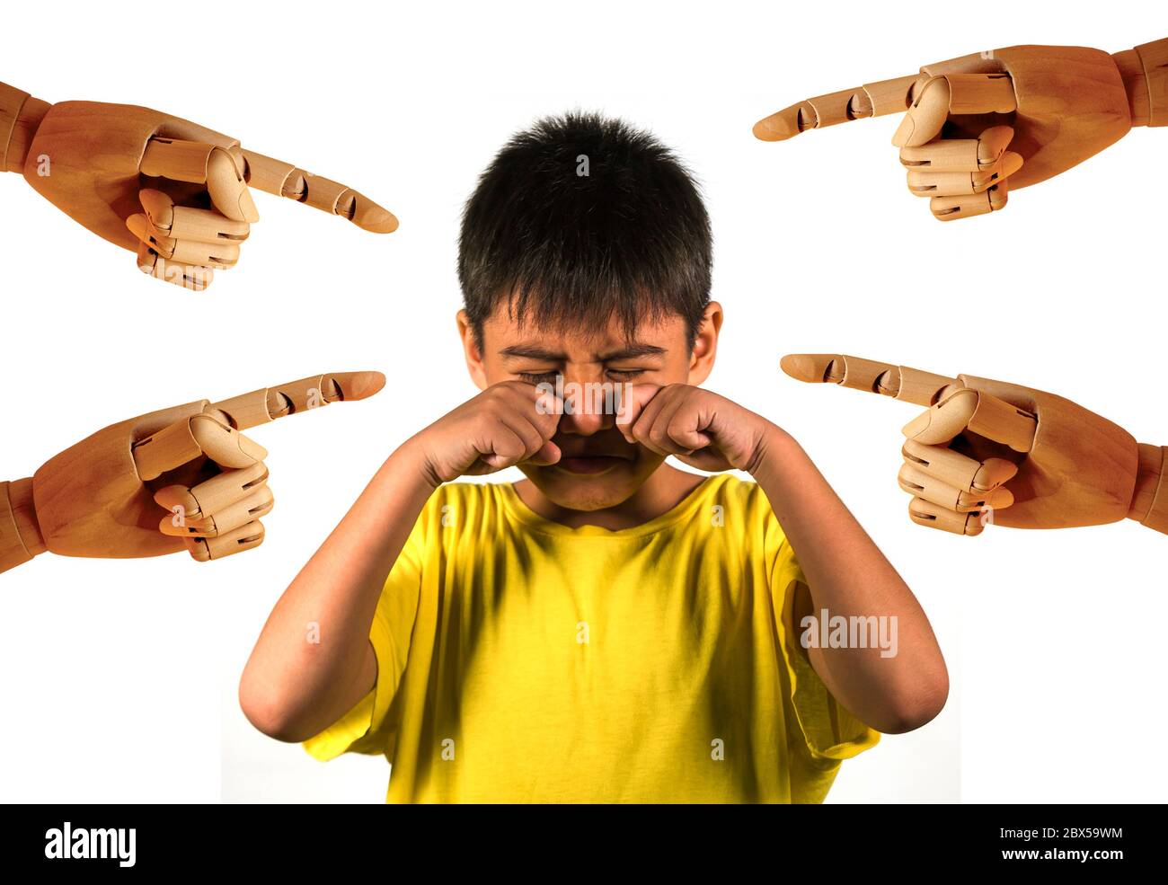 group of wood hands pointing finger to young sad and stressed schoolboy ...