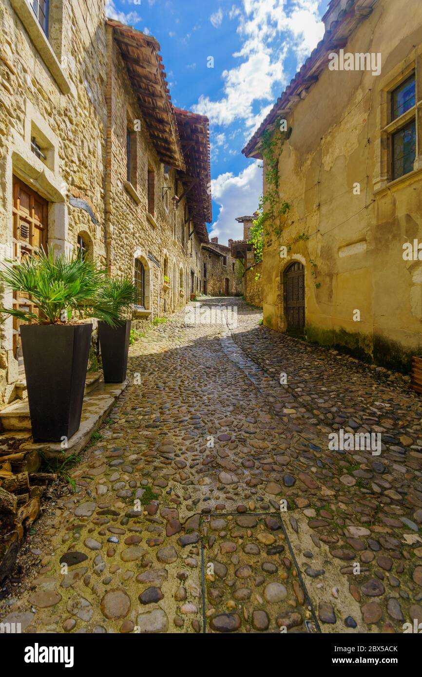 View of an alley in the medieval village Perouges, Ain department ...