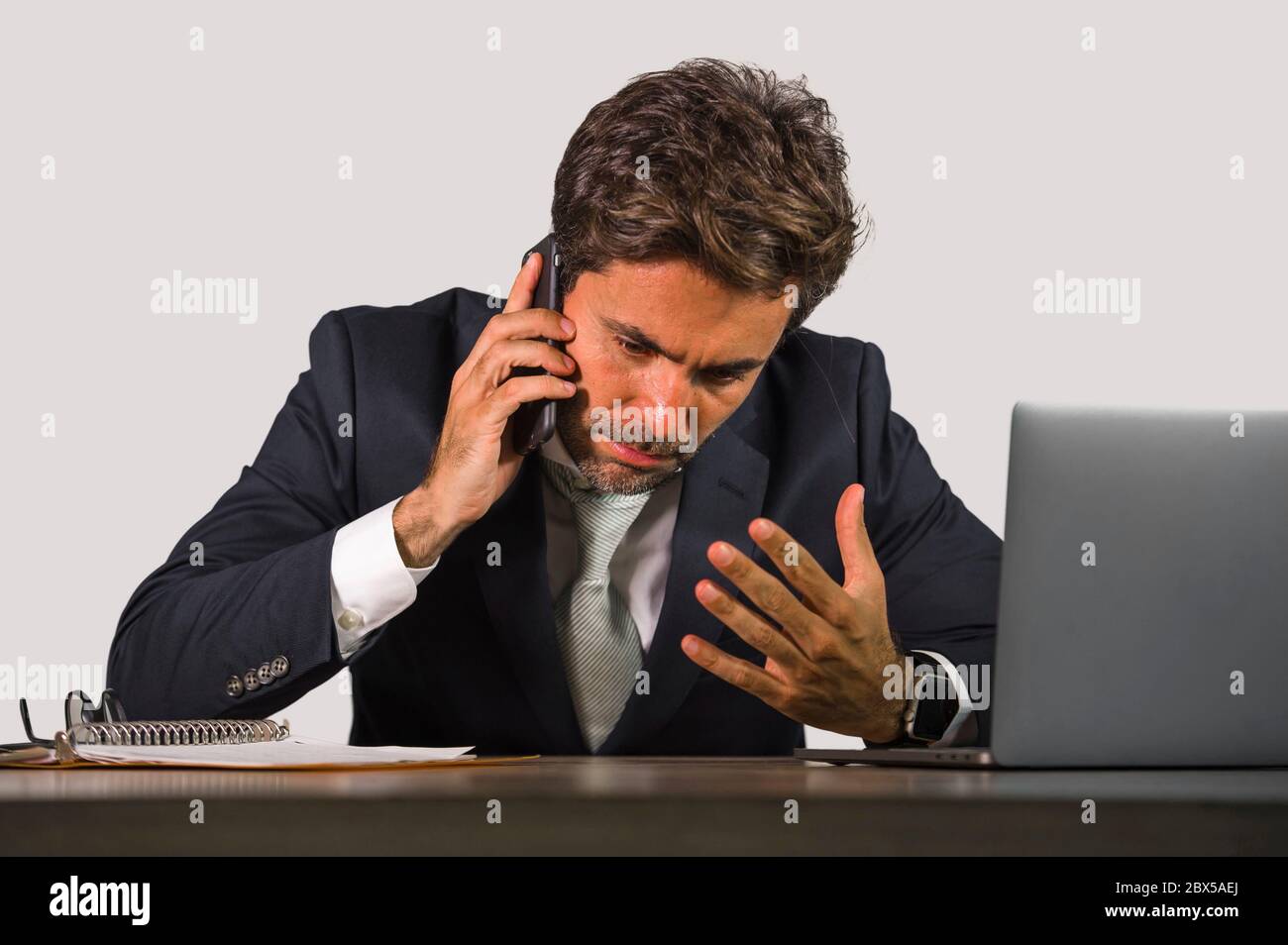 young stressed and upset business man working at office computer desk ...