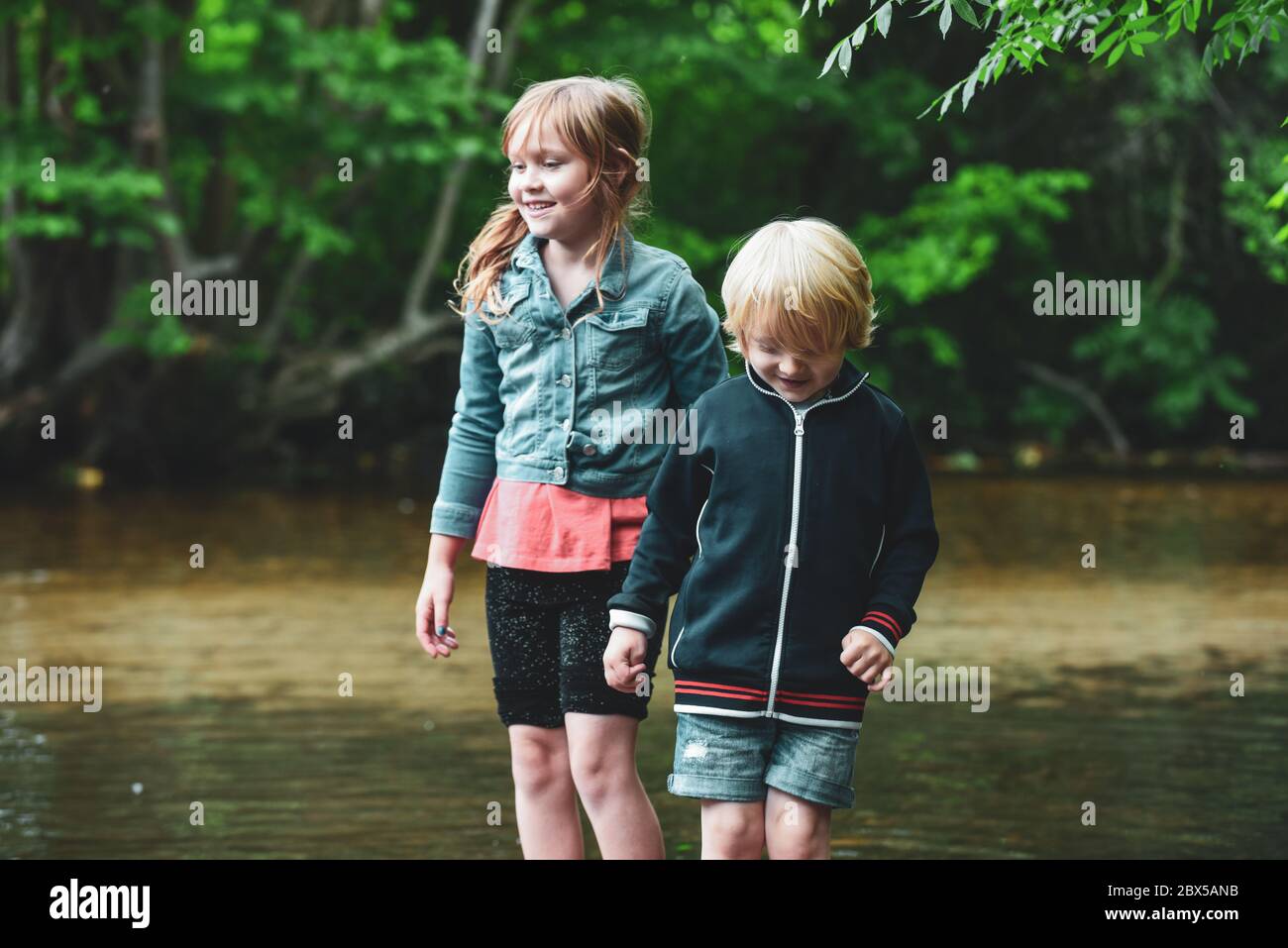 Boy Paddling In Shallow Water High Resolution Stock Photography and ...