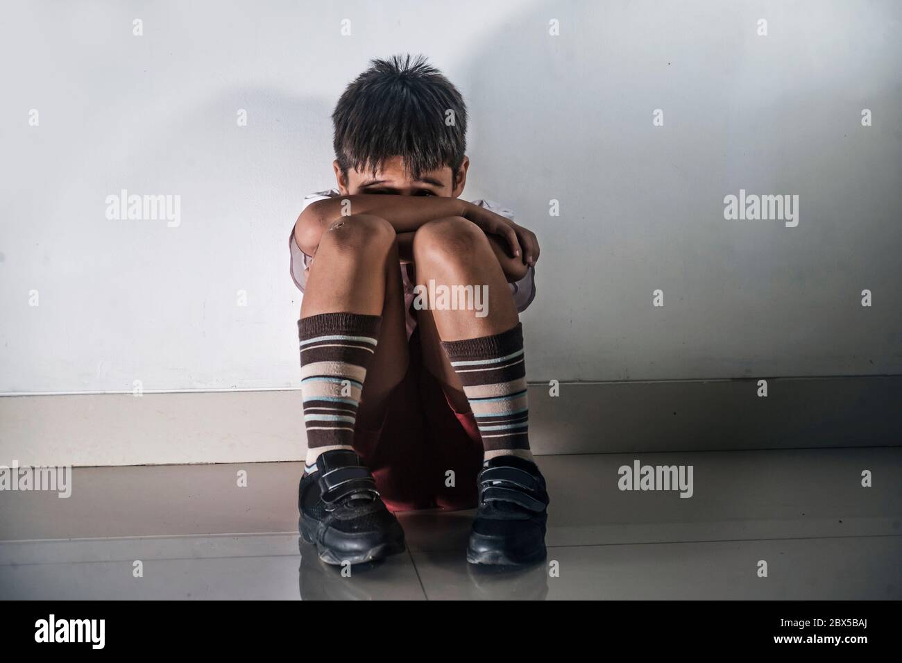 lifestyle dramatic bullying victim portrait of young sad and scared ...