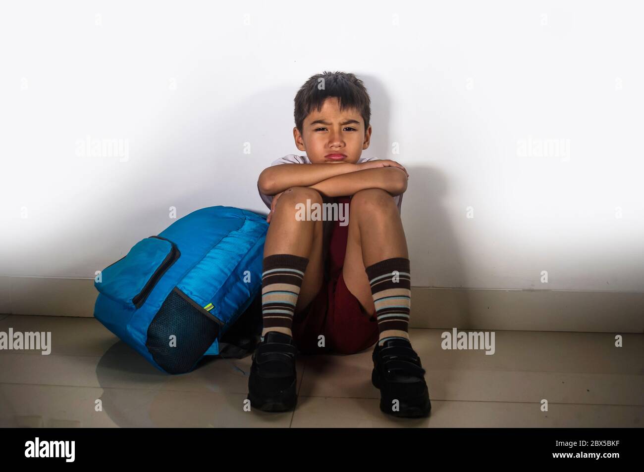 lifestyle dramatic bullying victim portrait of young sad and scared ...