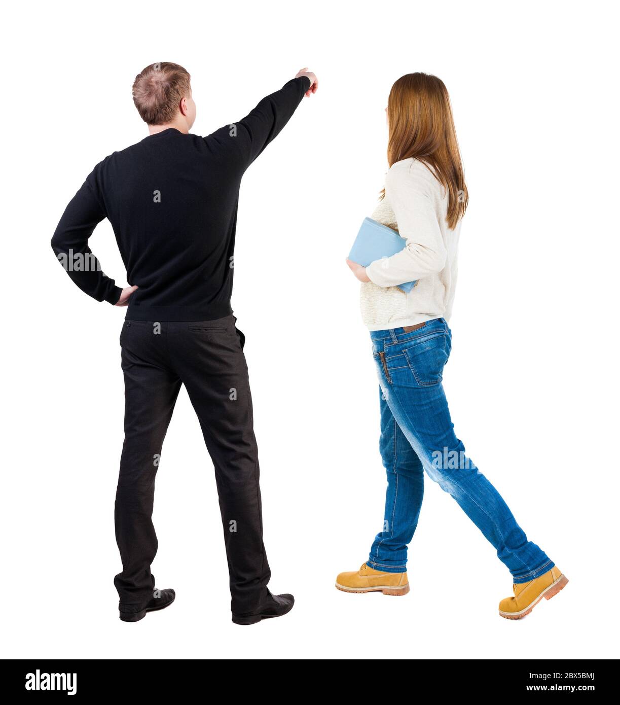 Back view of couple in sweater pointing. Rear view people collection ...