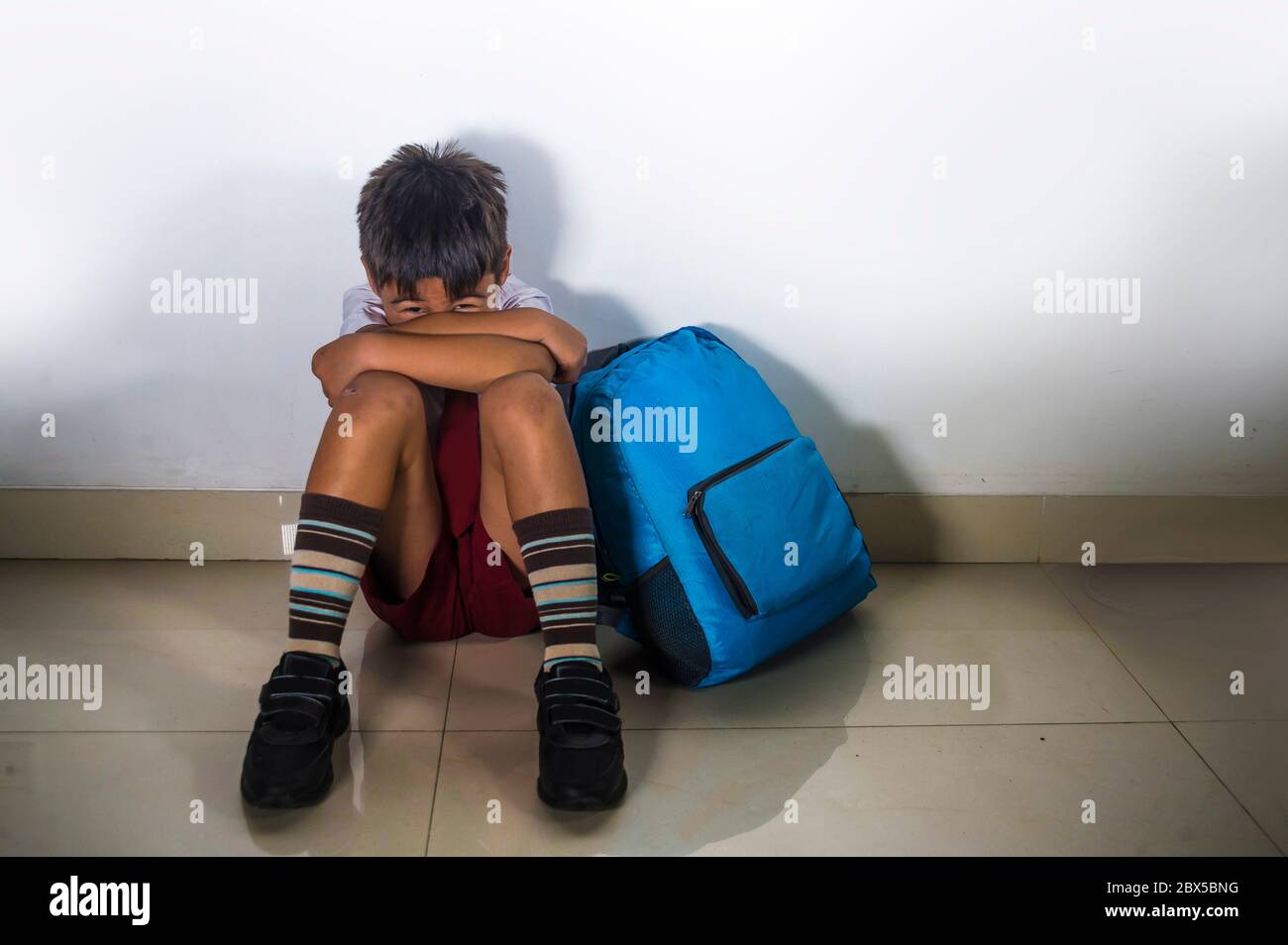 lifestyle dramatic bullying victim portrait of young sad and scared ...