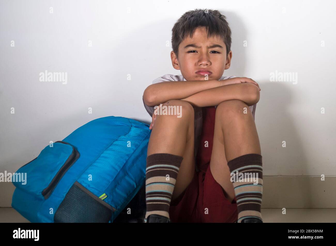 lifestyle dramatic bullying victim portrait of young sad and scared ...