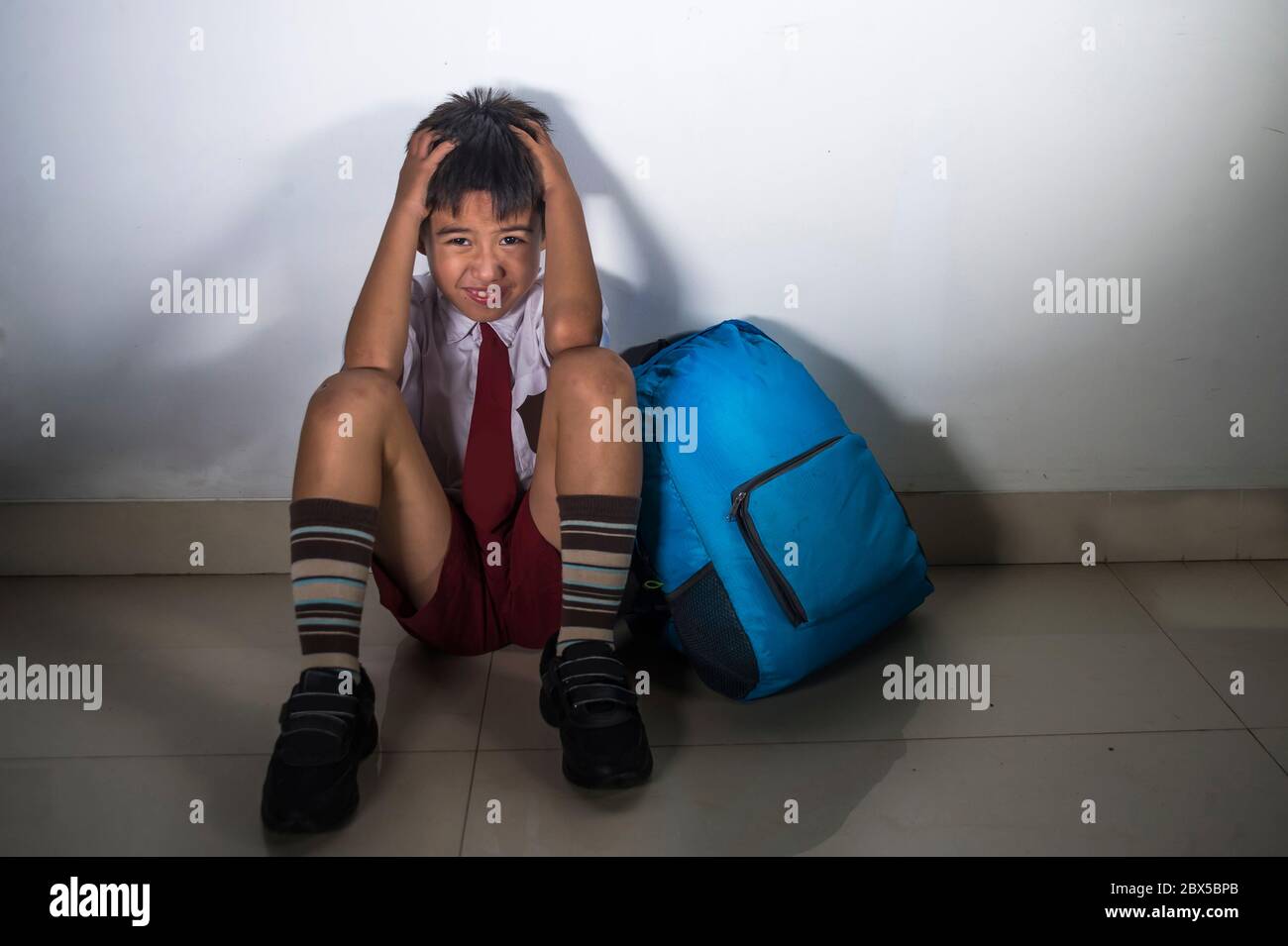 lifestyle dramatic bullying victim portrait of young sad and scared ...