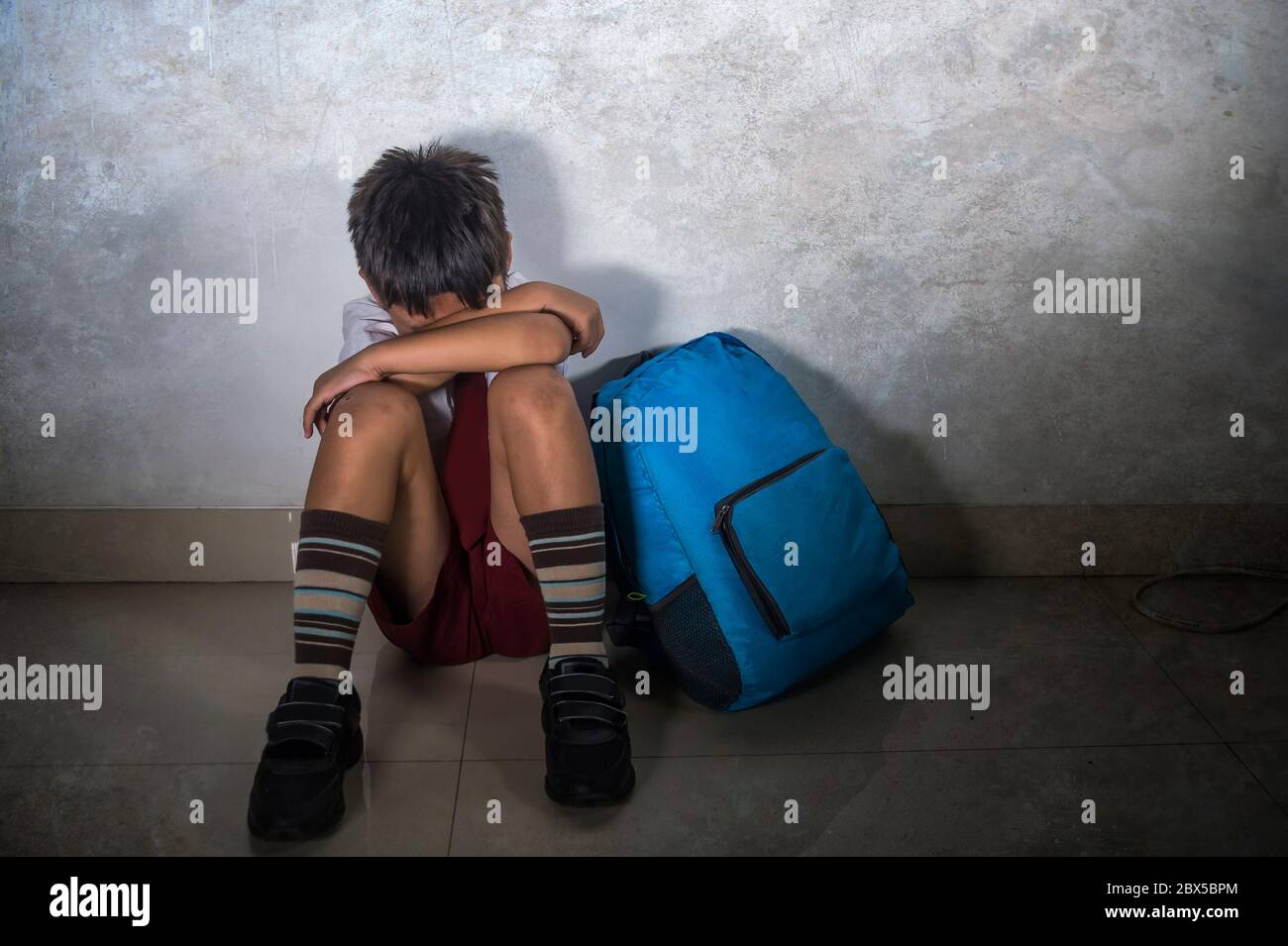 lifestyle dramatic bullying victim portrait of young sad and scared ...