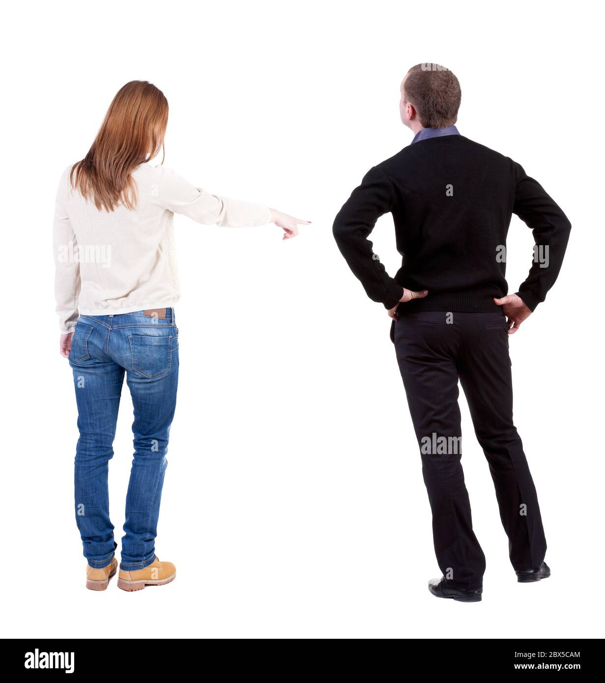 Back view of couple in sweater pointing. Rear view people collection ...