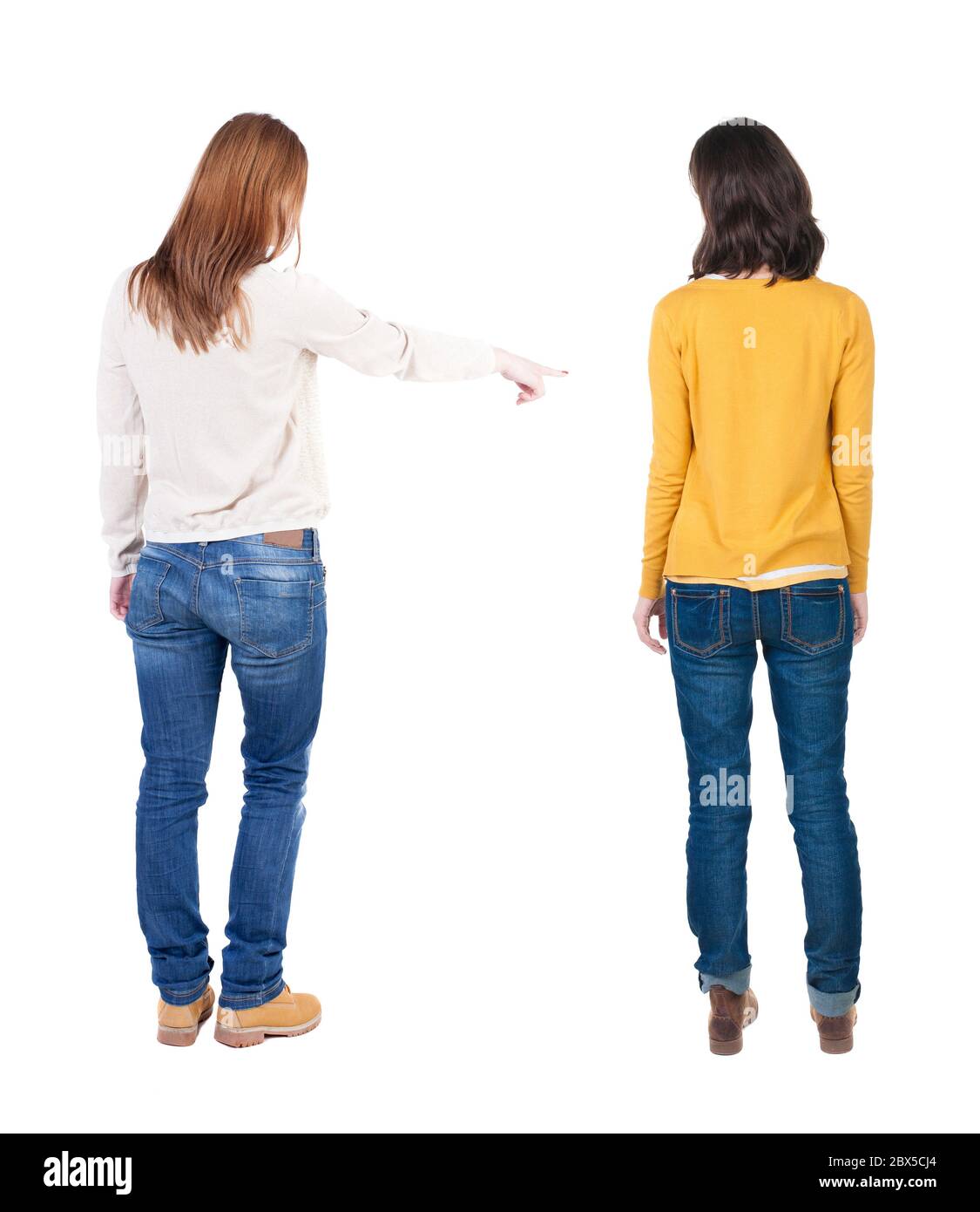 Back view of two pointing girl in sweater. Rear view people collection ...
