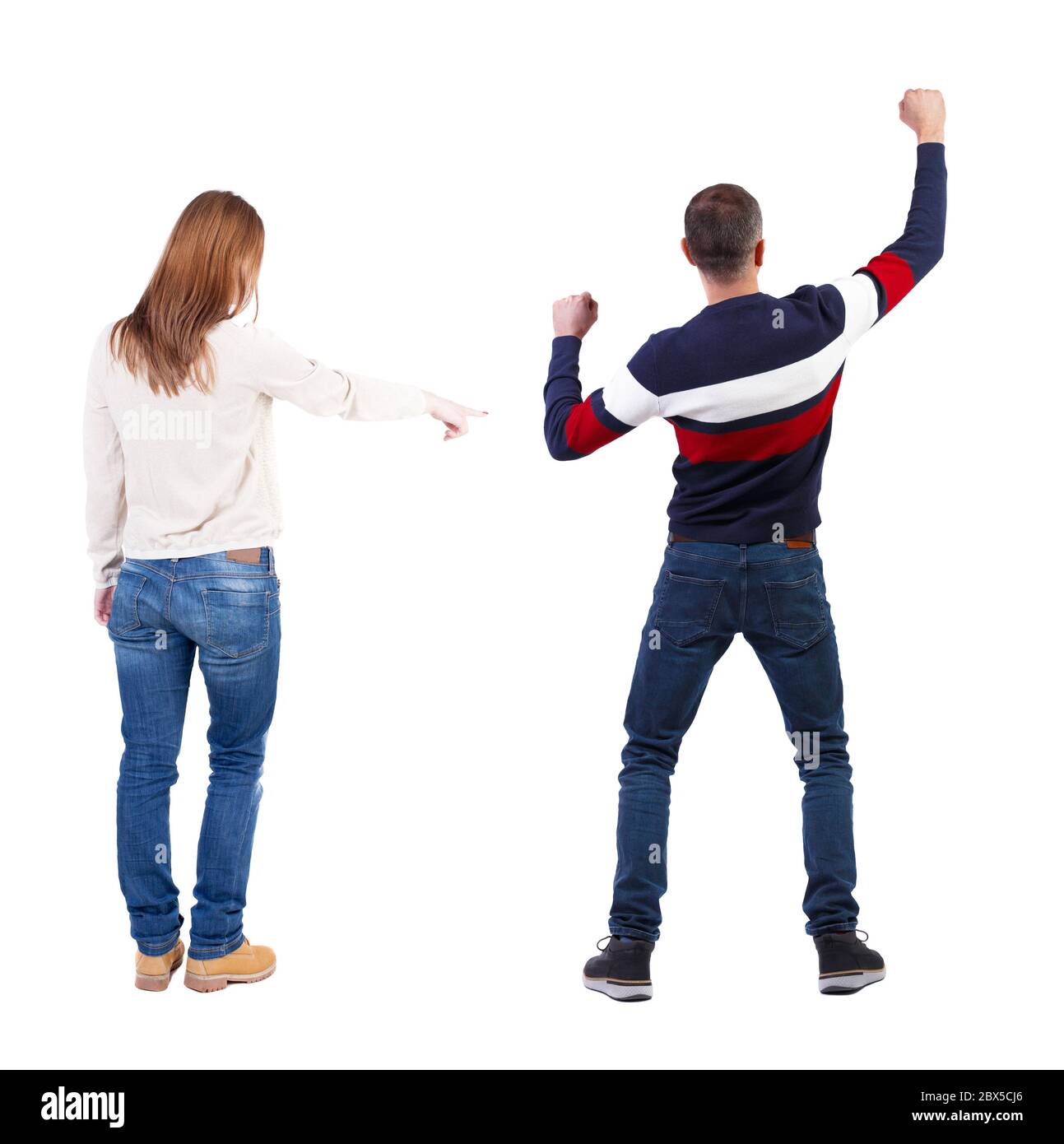 Back view of couple in sweater pointing. Rear view people collection ...