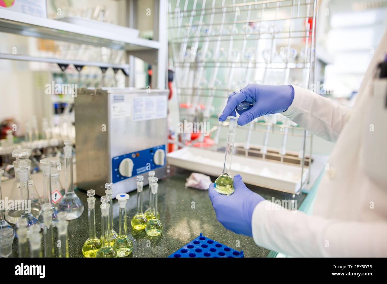 Flasks with liquids in a lab, pharmaceutical industry factory and ...