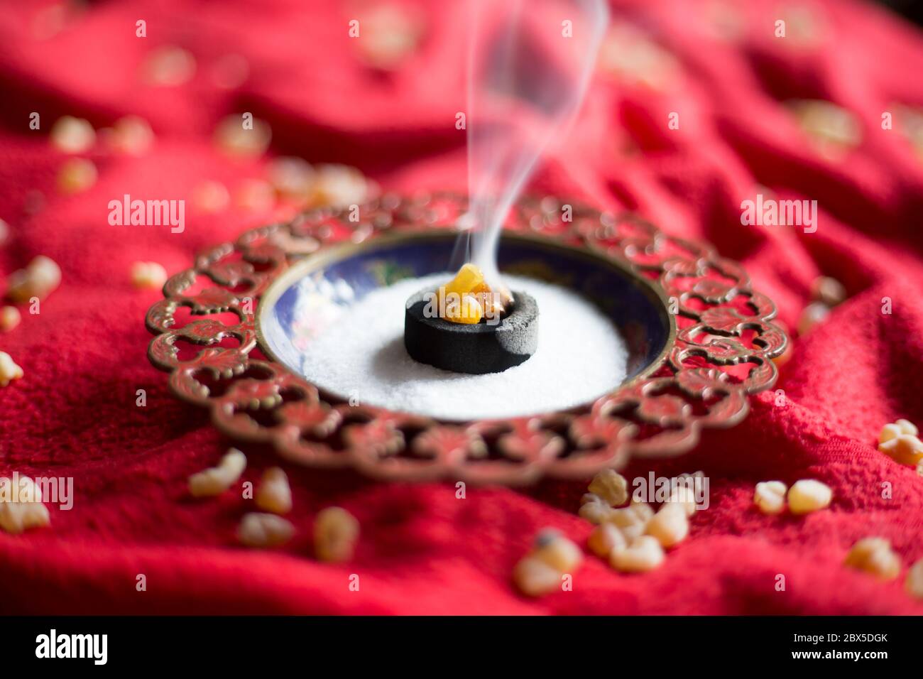 Frankincense burning on a hot coal. aromatic resin, used for religious ...