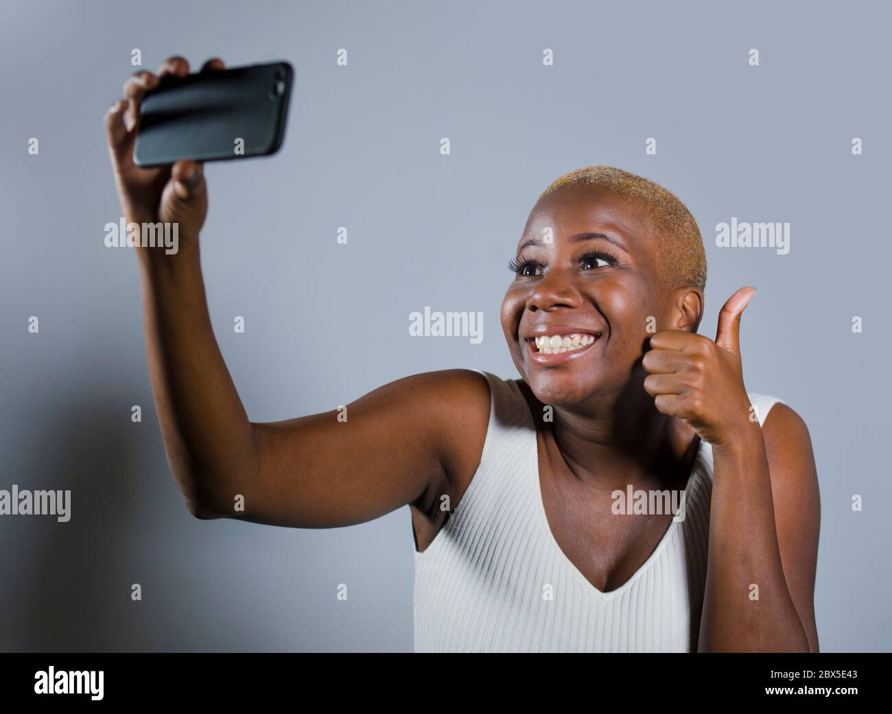 young beautiful and happy black afro American woman smiling excited ...