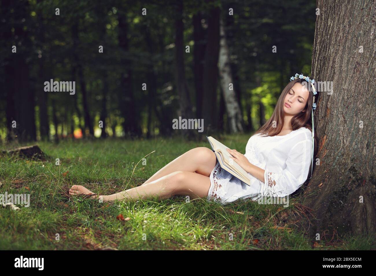 Girl sleeping in forest hi-res stock photography and images - Alamy