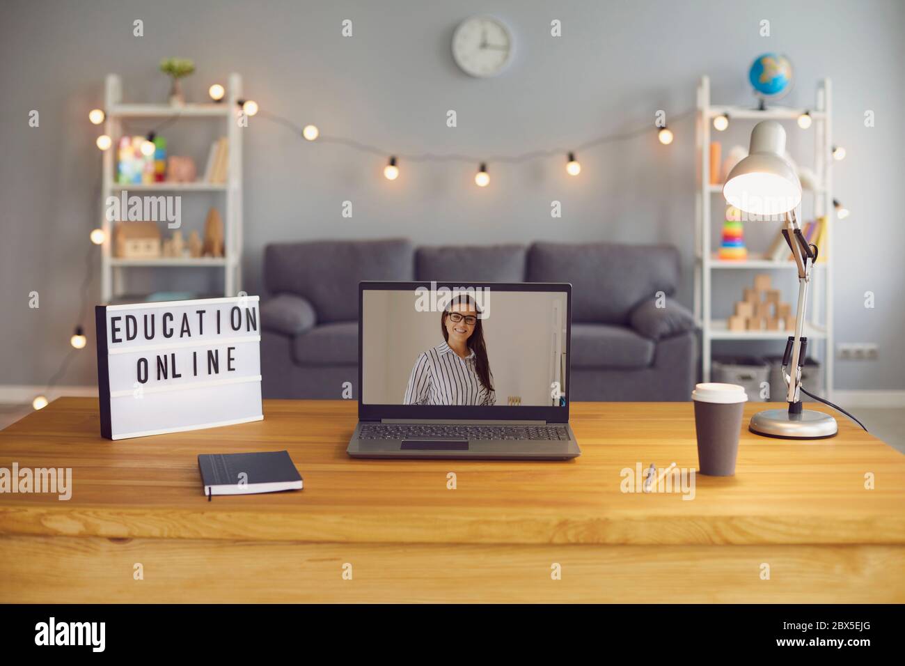 Online education. Laptop computer with young teacher giving class ...