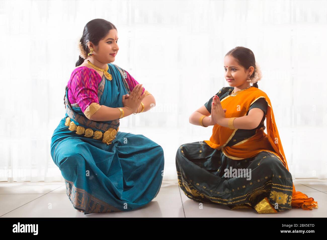 Young bharatnatyam dancer learning from her teacher Stock Photo - Alamy