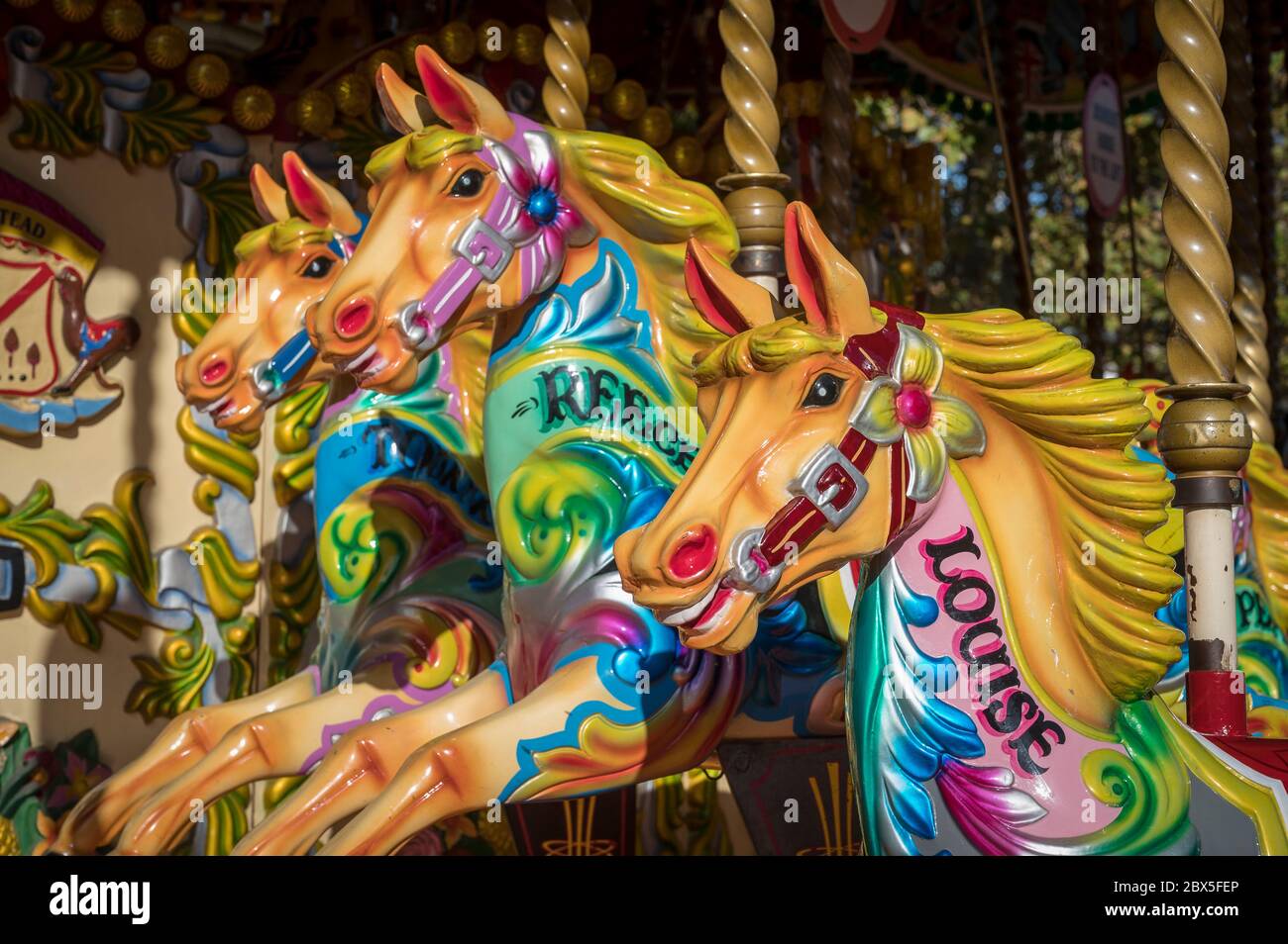 Painted horses on a carousel ride at a fairground Stock Photo - Alamy