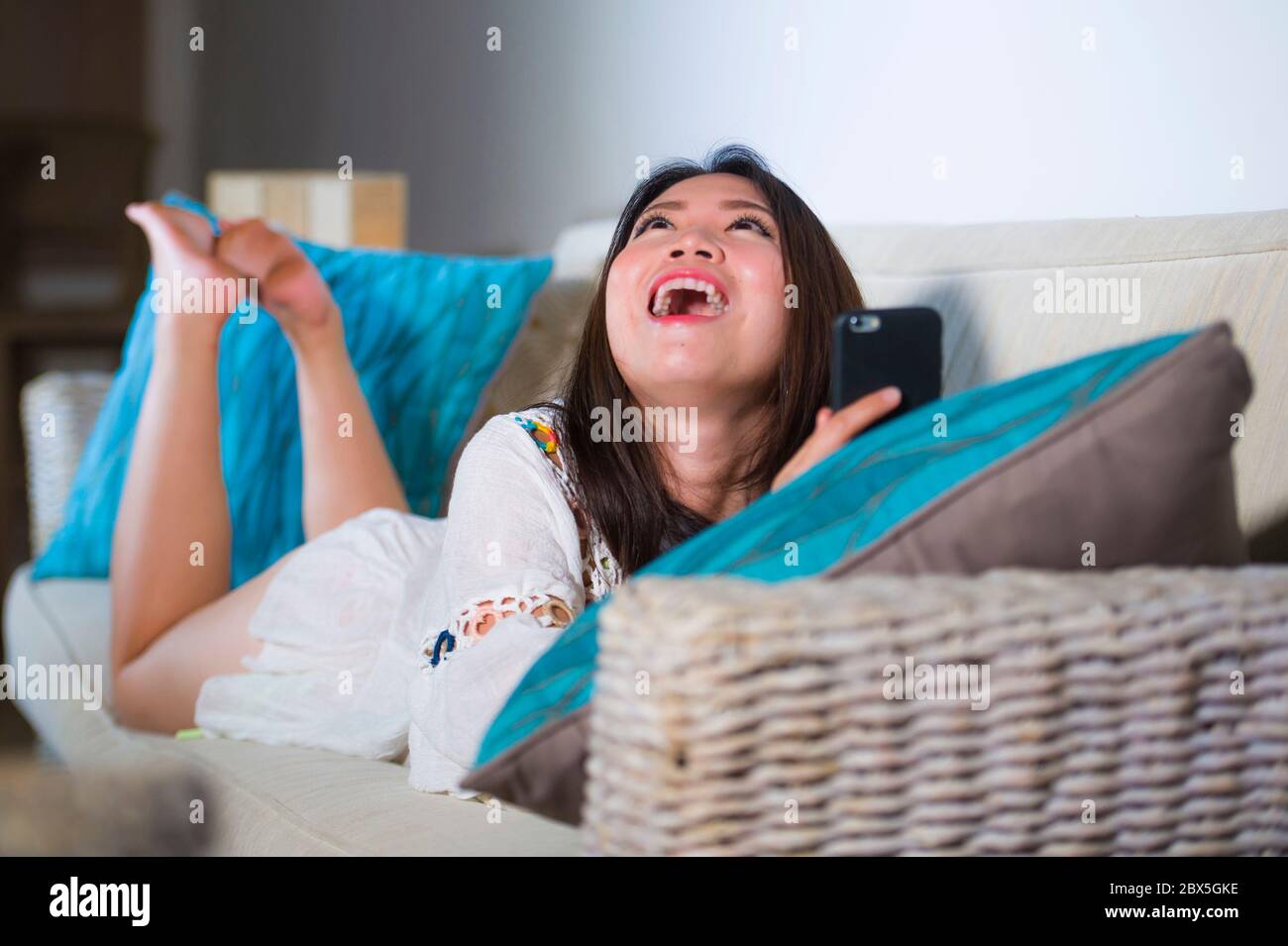 Young Beautiful And Happy Asian Chinese Woman On Her 20s Or 30s Lying