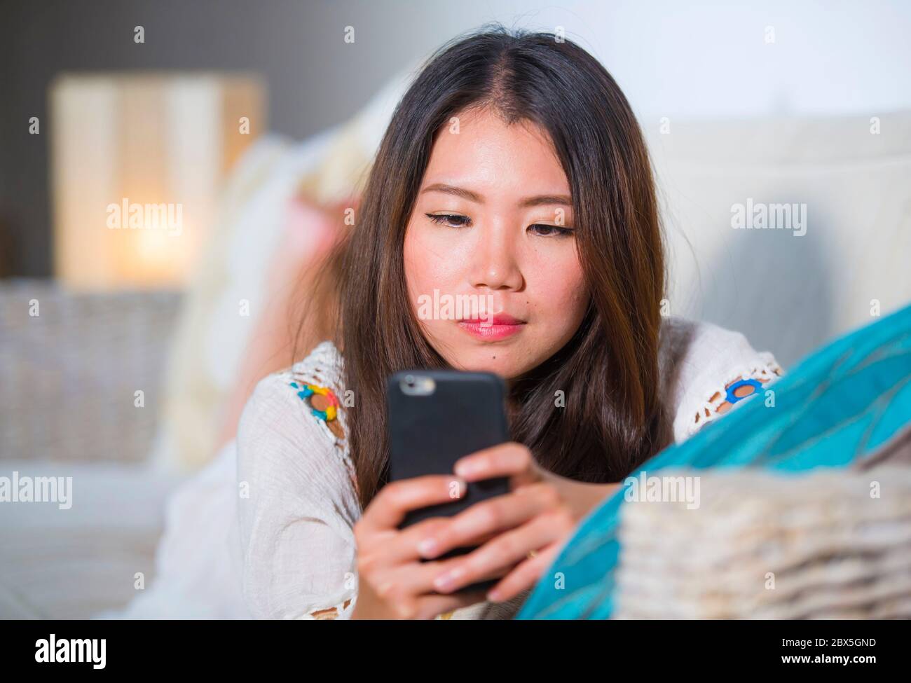 Young Beautiful And Happy Asian Chinese Woman On Her 20s Or 30s Lying