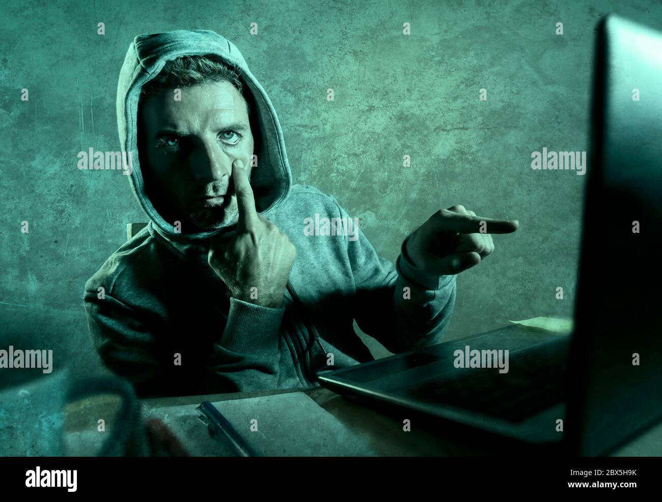 Dangerous Looking Hacker Man In Hoodie Hacking Internet Computer System