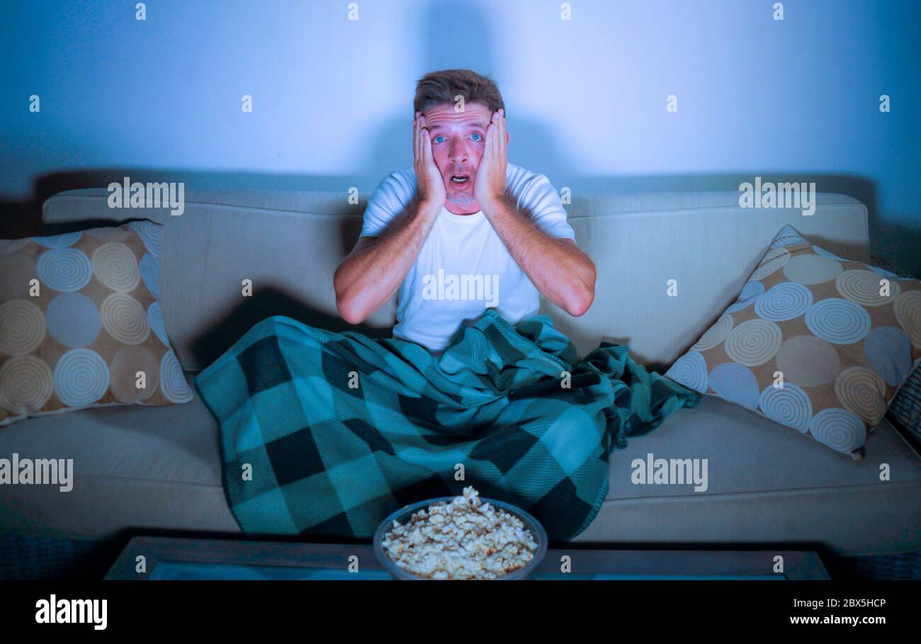 lifestyle portrait of attractive scared and nervous man watching ...