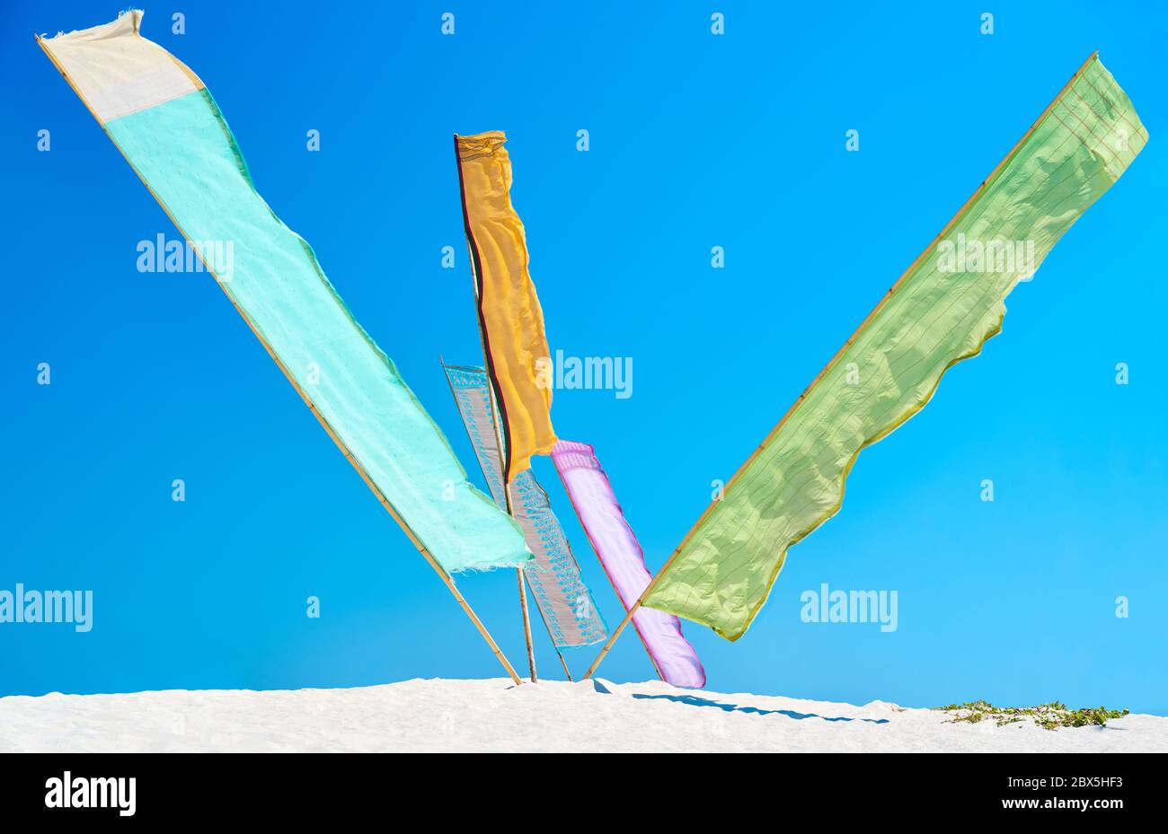 Multicolor flags over blue sky background on sunny day Stock Photo - Alamy