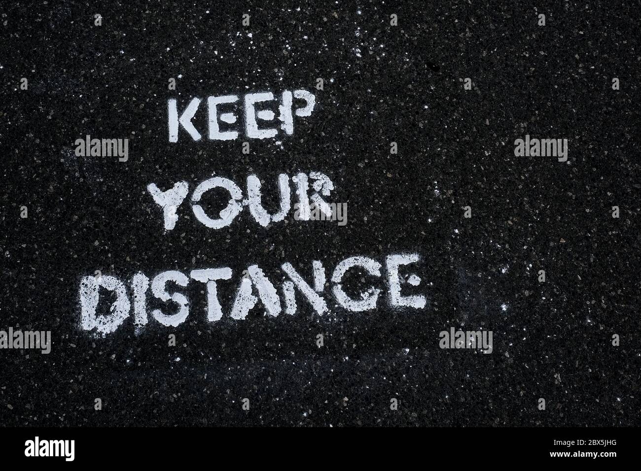 A keep your distance sign at Lingfield Racecourse Stock Photo - Alamy