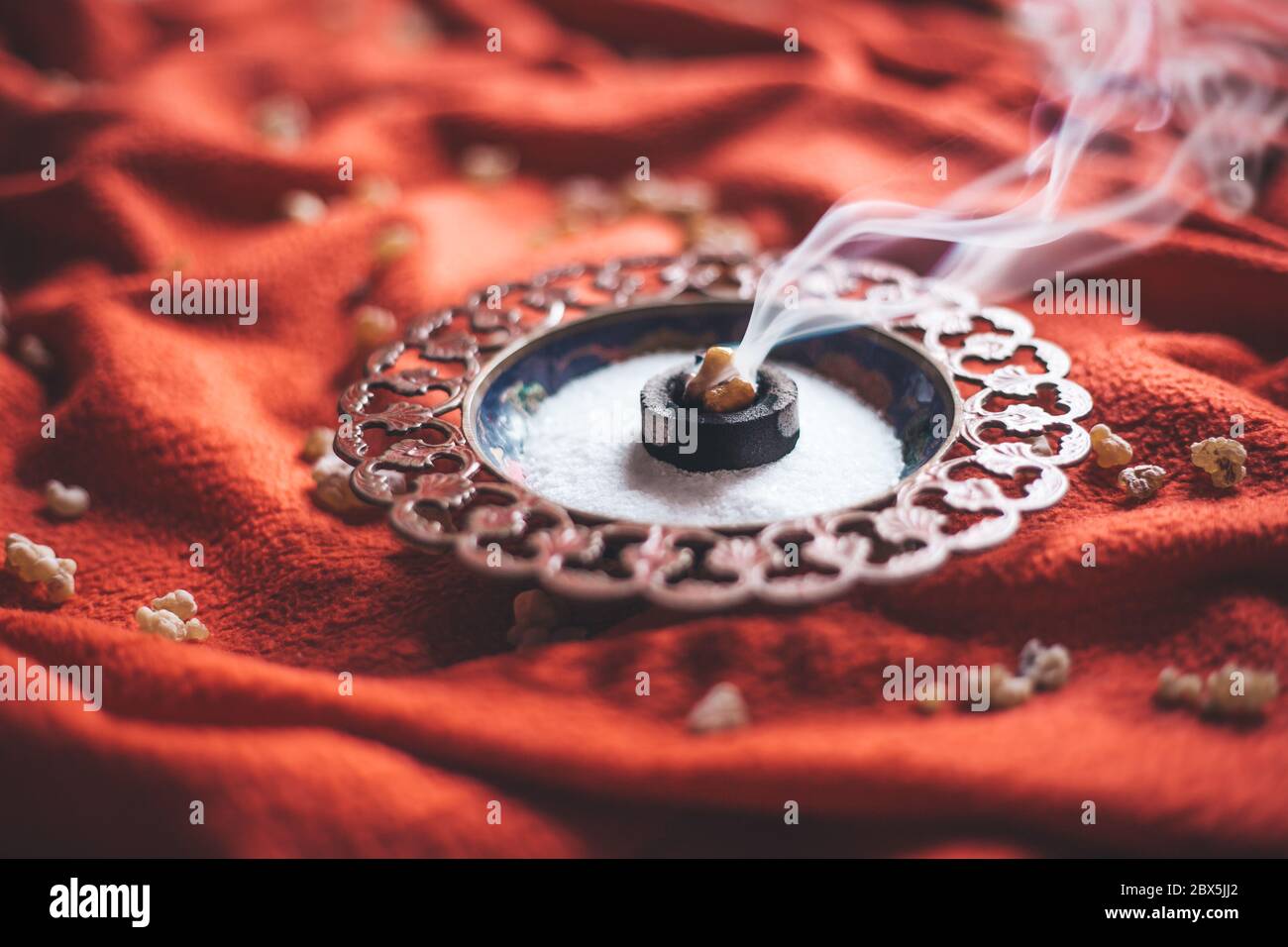 Frankincense burning on a hot coal. aromatic resin, used for religious ...