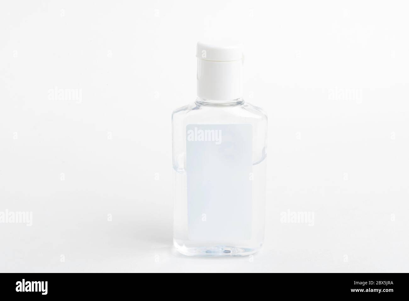 A product shot of a generic pocket-size transparent hand sanitizer ...