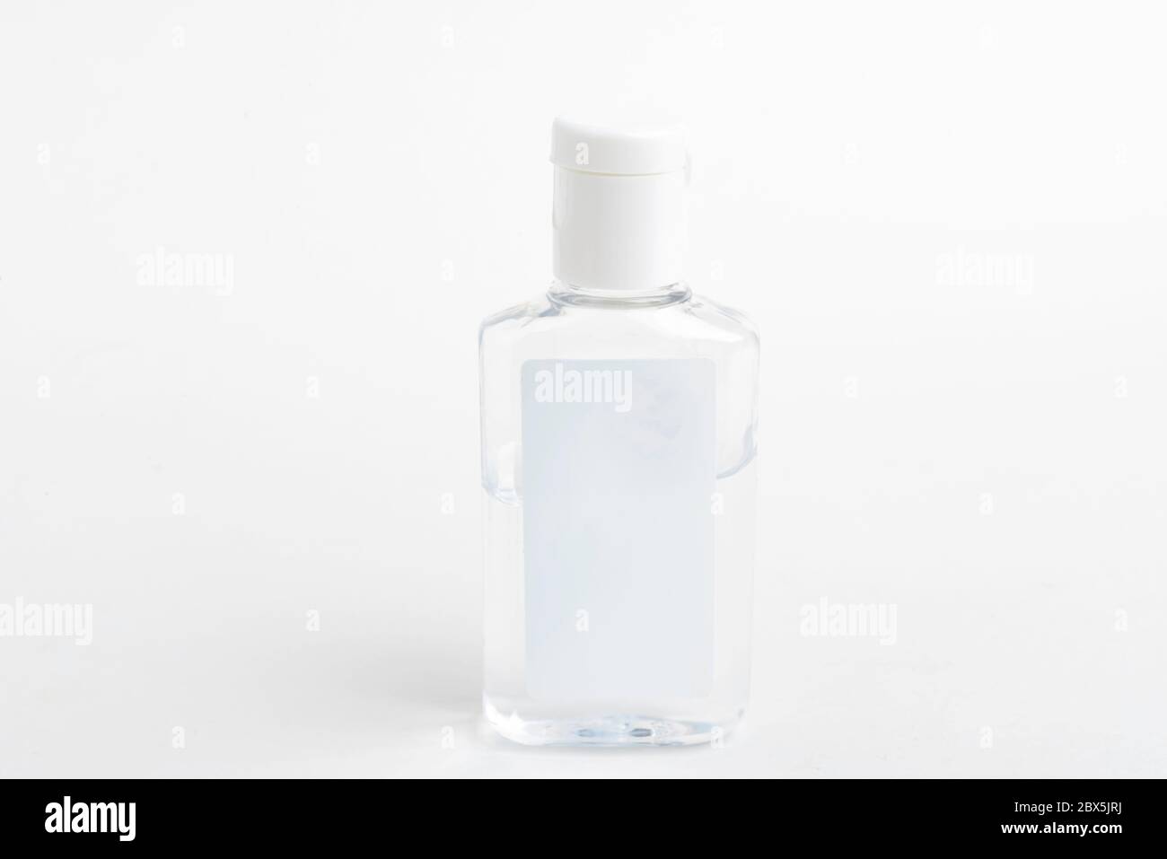 A product shot of a generic pocket-size transparent hand sanitizer ...