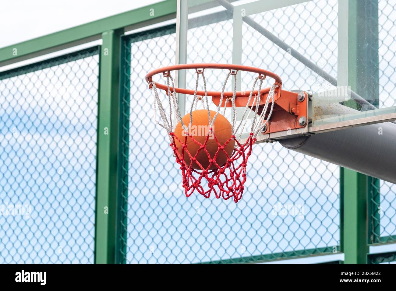 Basketball ring with a net and ball, sport Stock Photo - Alamy