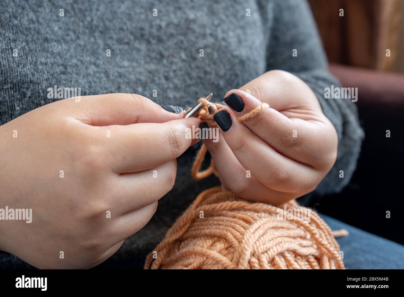 Women's hands knit from color wool. Hand knitting Stock Photo - Alamy