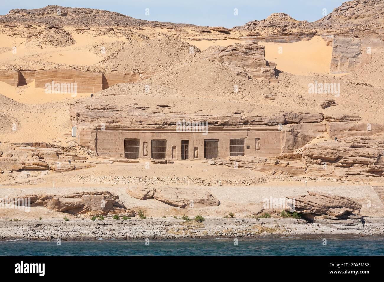 A small temple carved into the rocks on the River Nile, Egypt, Africa ...