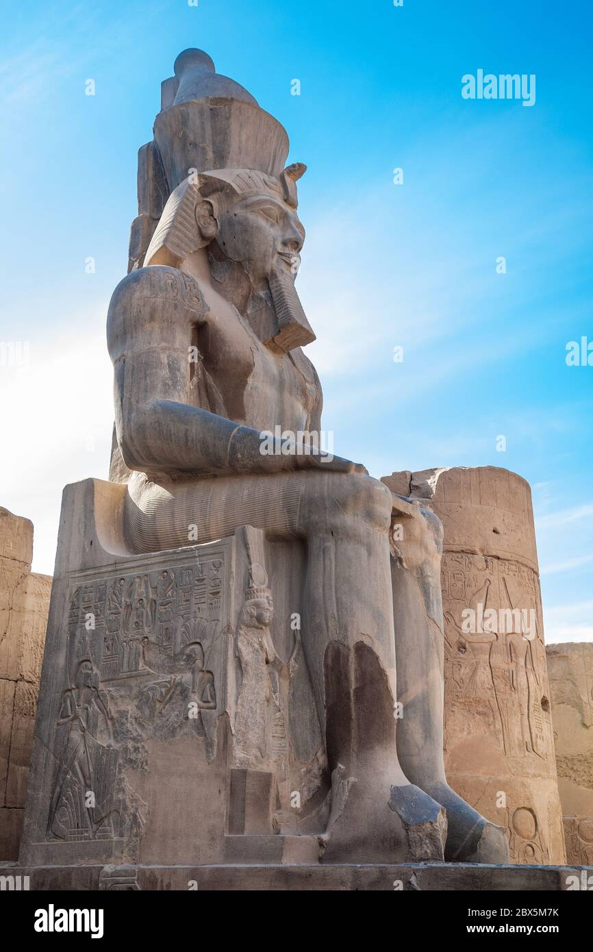 Seated statue of Pharaoh in Karnak Temple complex, Luxor, Egypt Stock ...