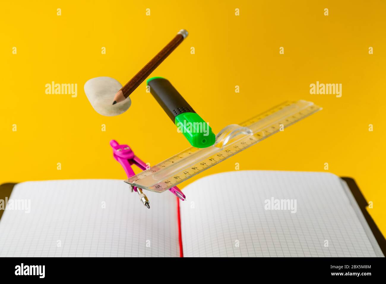 Levitating school supplies for math - notebook, pen, ruler, pencil ...