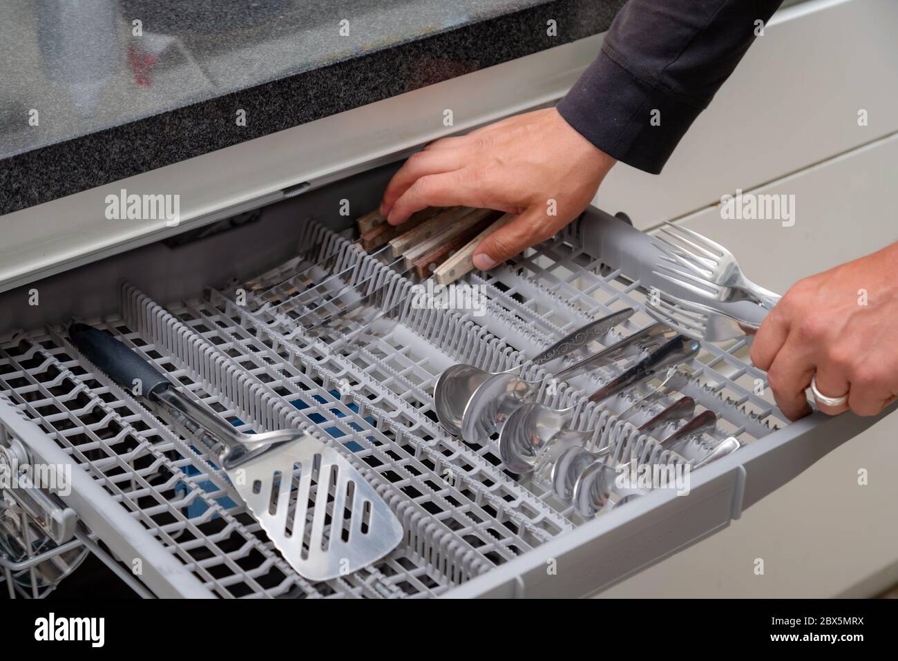 Unloading dishwasher hi-res stock photography and images - Alamy