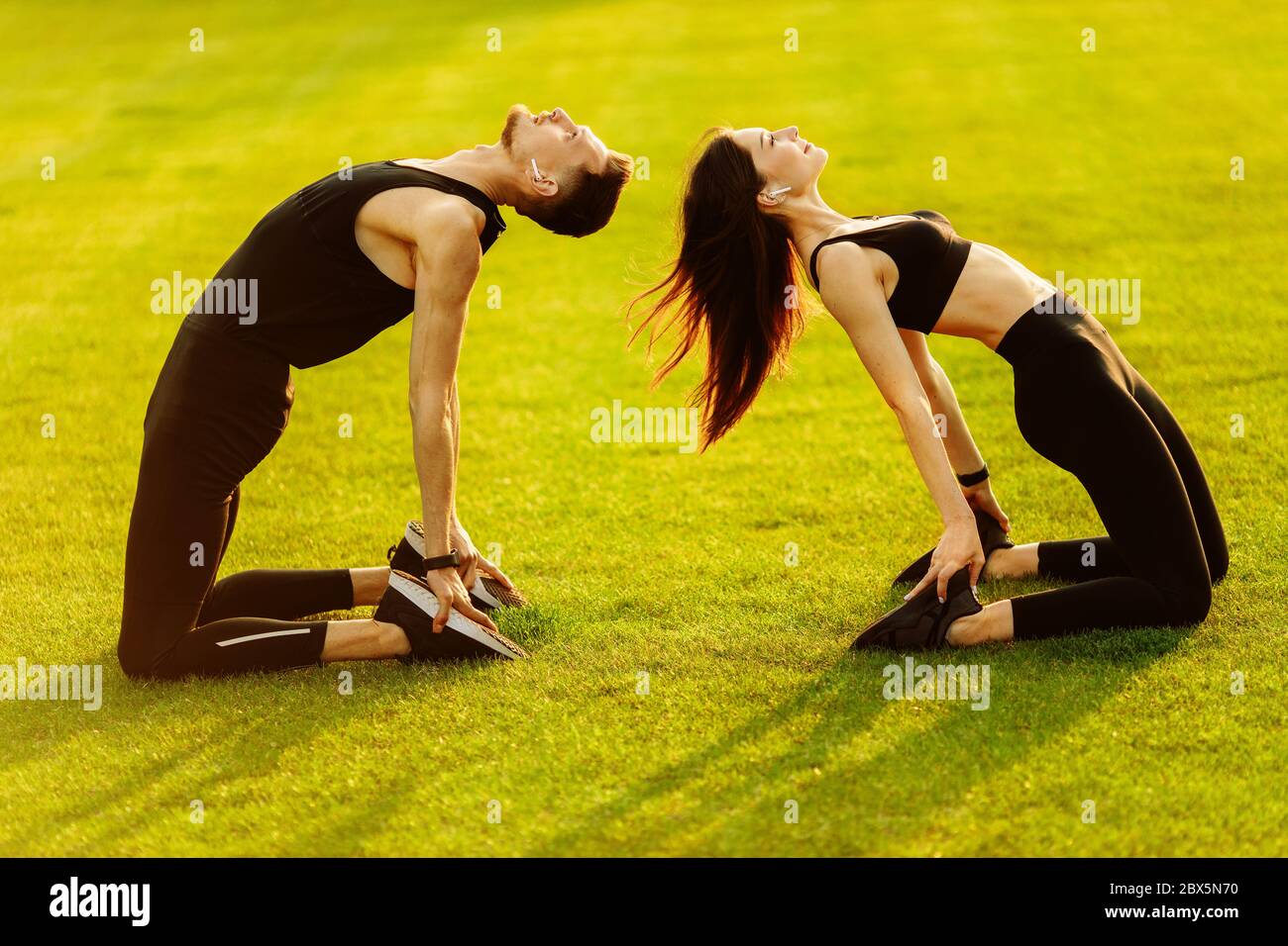 Young sporty man stretching hi-res stock photography and images - Alamy