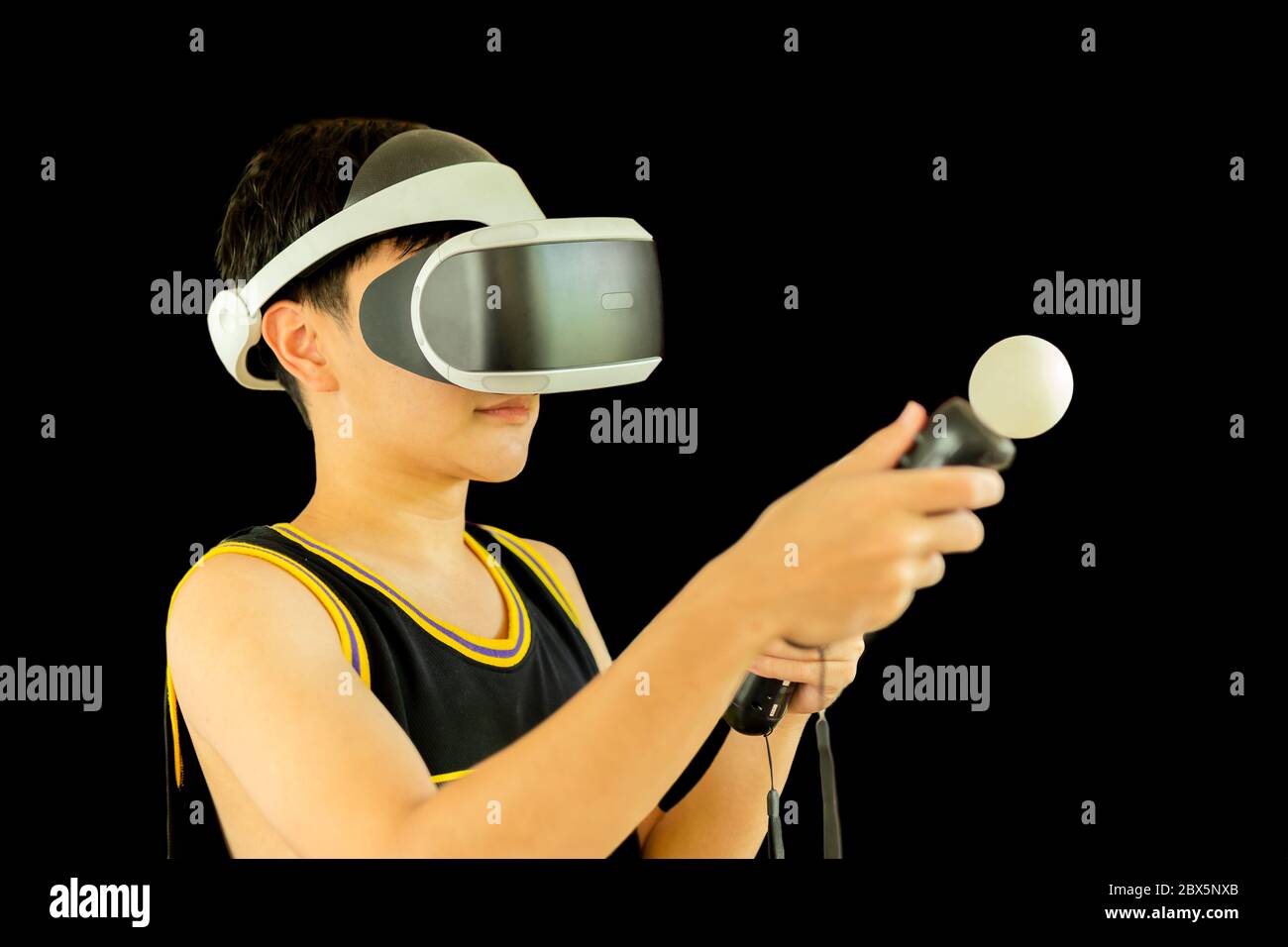 Teenager boy playing game with Virtual reality headset with goggles ...