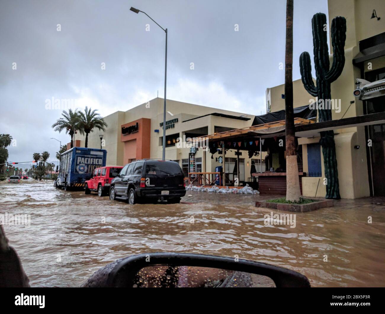 Flooded street in Cabo San Lucas, Baja California. Muddy waters in the ...