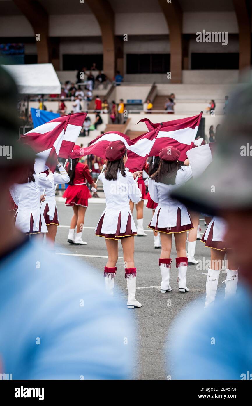 A festival parade of young Filipino girls perform at the Feast of the ...