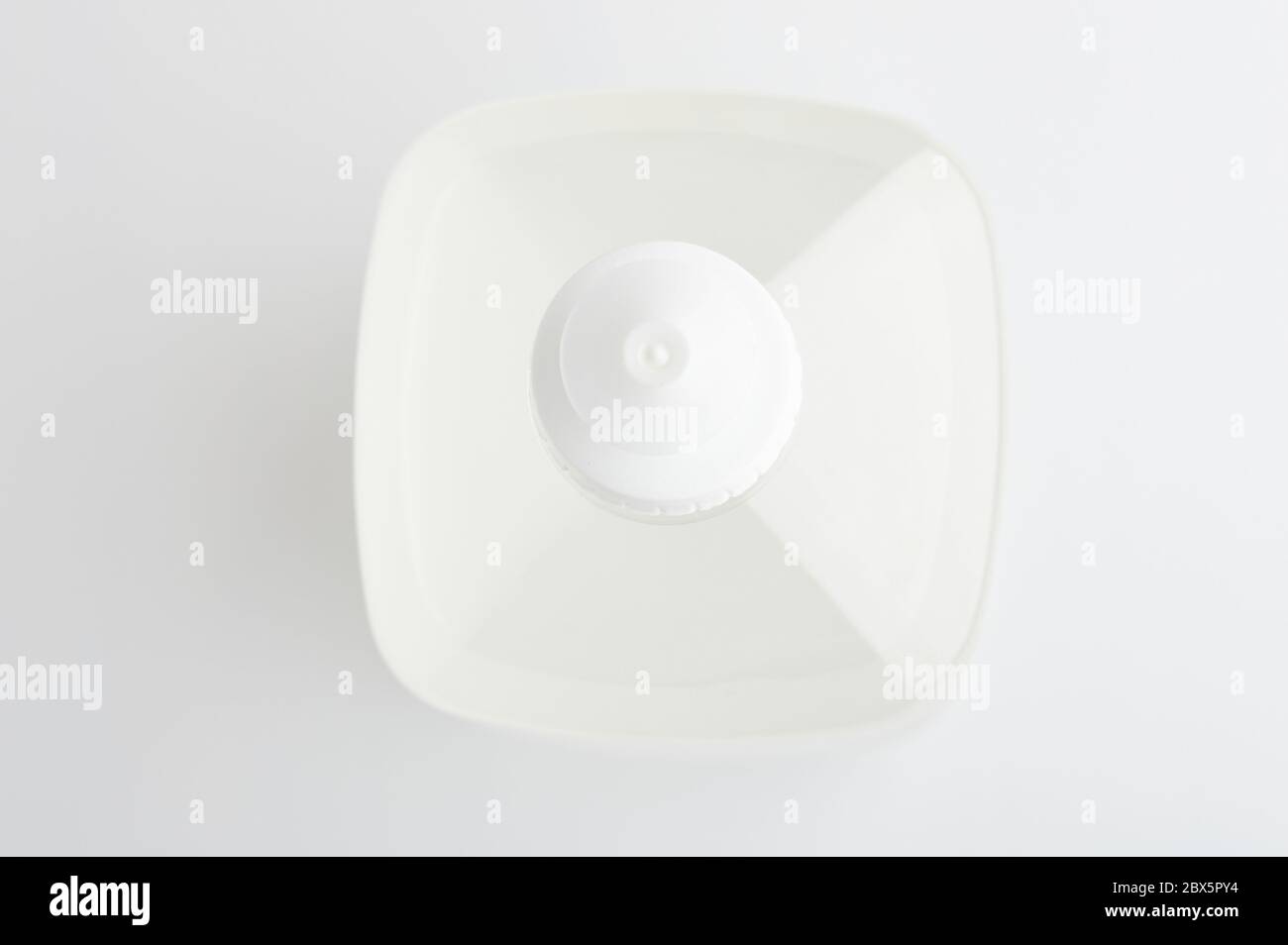 White plastic bottle above top view isolated Stock Photo - Alamy