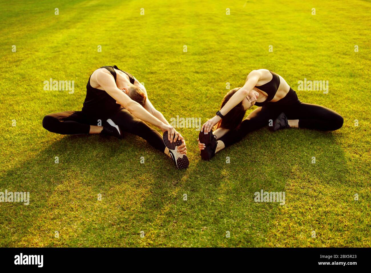 Young sporty man stretching hi-res stock photography and images - Alamy