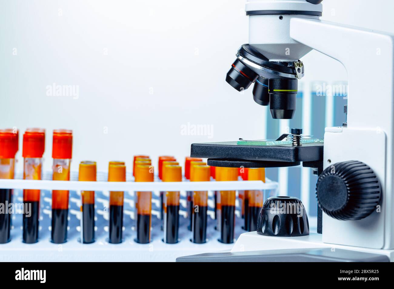 Microscope with test tubes for research close up Stock Photo - Alamy